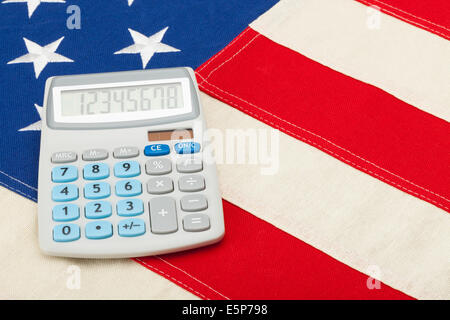 Neat calculator over USA flag Stock Photo - Alamy