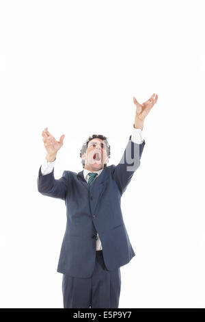 business man reaching to grab something from above his head, man in ...