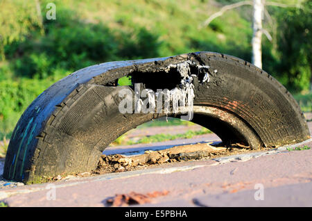 damaged tire after tire explosion at high speed on highway Stock Photo ...