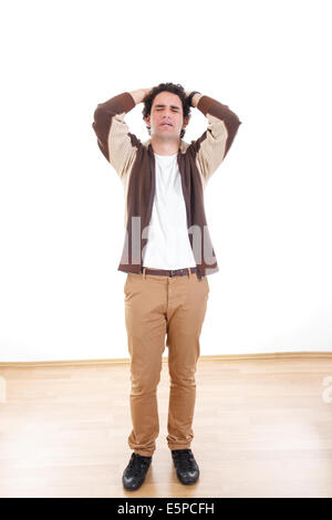 Frustrated and desperate man holding hands on head, looking sad and ...