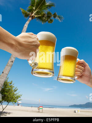 hands toasting with beer Stock Photo - Alamy