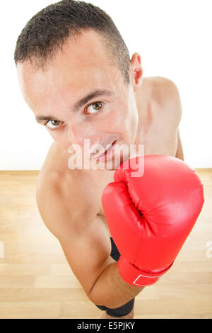Muscular man boxing in gloves Stock Photo - Alamy