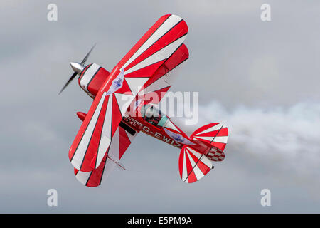 Pitts Special S2S aerobatic display plane in the sky with smoke trails ...