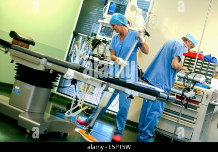 Hospital cleaning staff disinfecting operating room Stock Photo - Alamy