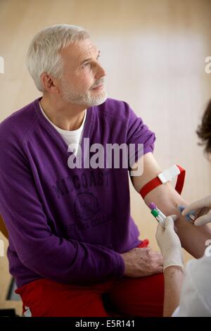 Man having a blood sample Stock Photo - Alamy