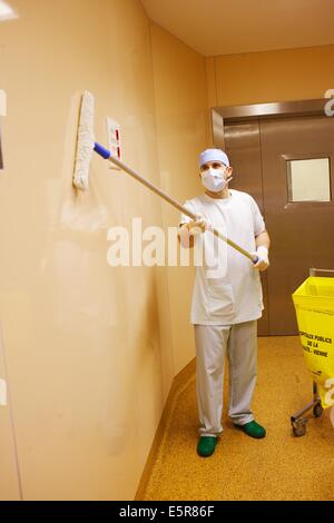 Hospital cleaning staff disinfecting operating room Stock Photo - Alamy