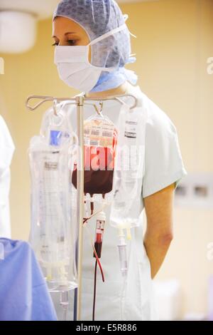 Medical student watching surgical procedure, Thoracic and ...