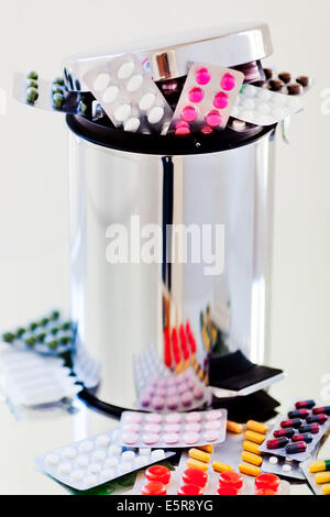 Drugs dumped into a trash can Stock Photo - Alamy