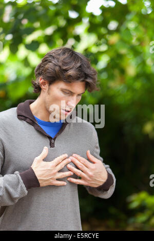Man suffering from a mild heart attack Stock Photo - Alamy