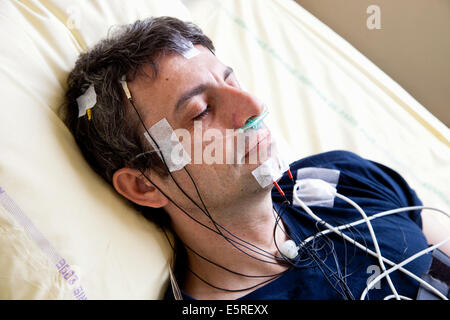 Man undergoing polysomnographic examination polysomnography study ...