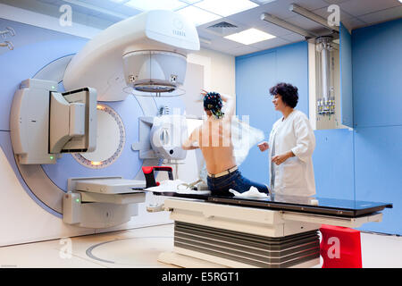 Radiotherapy radiographer and a female patient treated to a stomach ...
