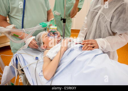 Mother accompany her child to the operating theatre, anesthesia ...