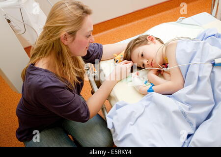 Mother accompany her child to the operating theatre, anesthesia ...