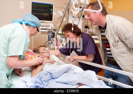Mother accompany her child to the operating theatre, anesthesia ...