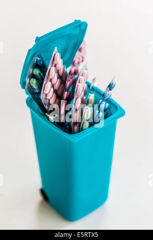 Drugs dumped into a trash can Stock Photo - Alamy