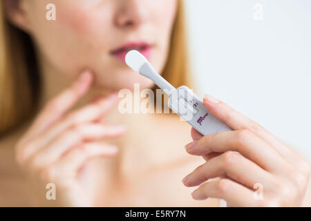 Woman using Oraquick ® HCV Hepatitis C Rapid Antibody Test Stock Photo ...