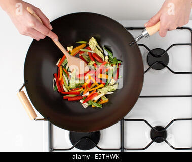 Stir frying vegetables in a wok Stock Photo - Alamy
