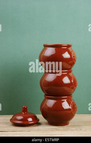 clay pots on an empty table Stock Photo - Alamy