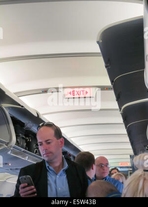 Businessmen on commercial flight Stock Photo - Alamy