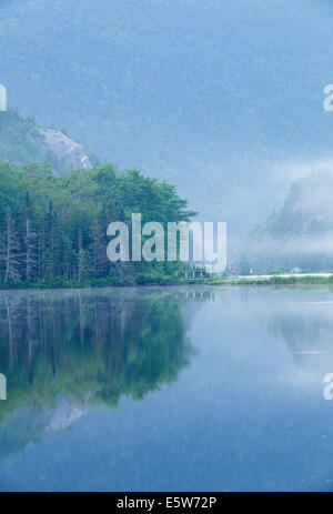 Reflection of Elephant Head rock profile in Saco Lake at the start of ...