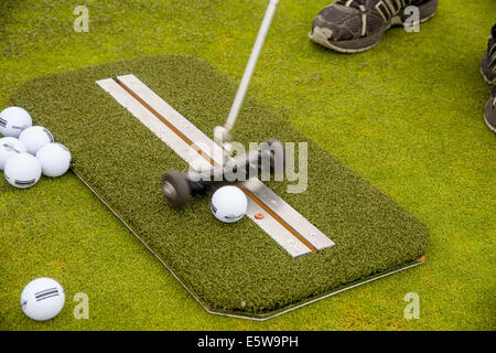 A ball is about to be hit with the "adjustable putter" at the Junior ...