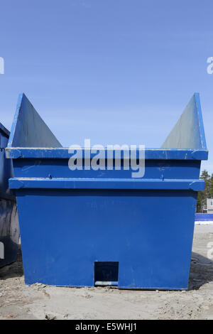 At construction site, there is metal container dumpster for storing ...