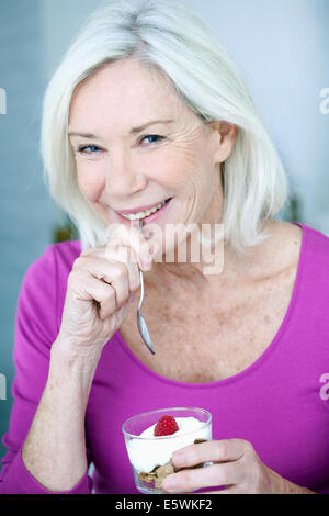 Elderly person snacking Stock Photo - Alamy