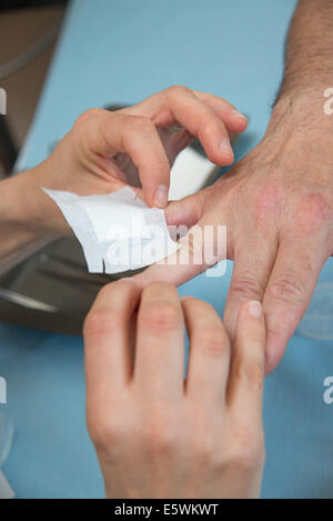 Paronychia infection of the finger. Close-up of the finger of a 7-year ...