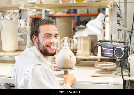 close up potter artist working on clay pottery sculpture fine art in ...