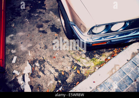 Cars or automobiles parked over the curb into sidewalk, leaving no ...