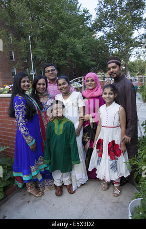 Muslim family and friends gathering together at home for eating dinner ...