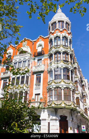 nice old building with highly decorated facade and large windows in ...
