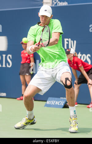 Toronto, Canada. 07th Aug, 2014. Novak Djokovic returns the ball during ...