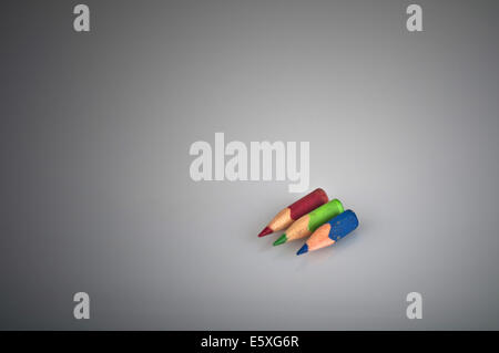 Three small used colored pencils Stock Photo - Alamy
