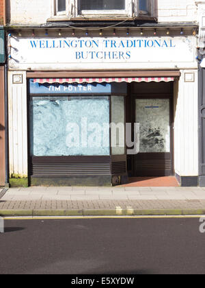Whitewashed window of shop which has closed down Stock Photo - Alamy