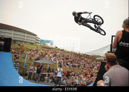 Newquay, Cornwall, UK. 8th August, 2014. Crowds watch pro BMX riders at ...