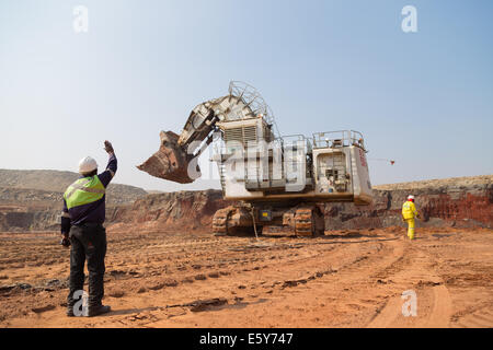 An electric Liebherr face shovel operator lifts its own power cable ...