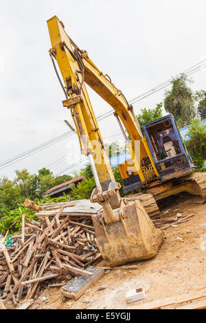 Medium sized Excavator at building area Stock Photo - Alamy