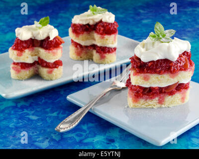 Homemade layered lemon cake with almonds on wooden board copyspace ...