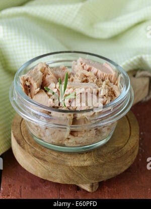 canned tuna with rosemary in a glass jar Stock Photo - Alamy