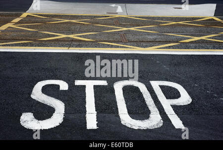 A stop sign painted on the road at a junction in the Peak District ...