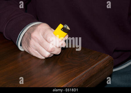 Man holding Lighter Stock Photo - Alamy