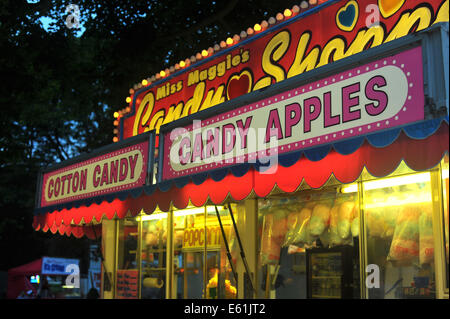 A candy food van at a funfair at night time Stock Photo - Alamy