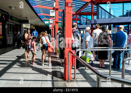 People waiting in Basildon Bus Station Stock Photo - Alamy