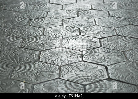 A pavement made of hexagonal slabs with Gaudi motif decorations in ...