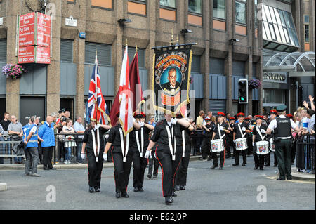 Members of the East Bank Protestant Boys Flute Band playing at the ...