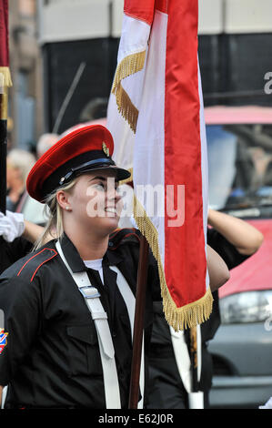 Female Flag Bearer with Marching Band in Parade Stock Photo - Alamy