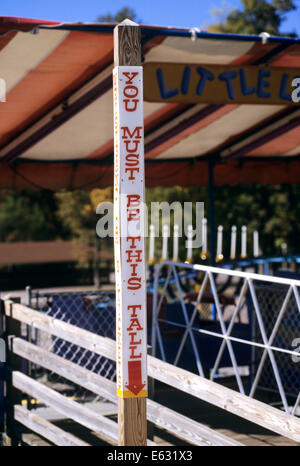 Sign for amusement ride height requirement Stock Photo - Alamy