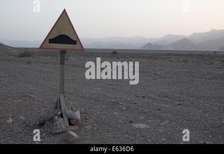 Desert road sign at dusk, Dibba, Fujariah, United Arab Emirates Stock ...