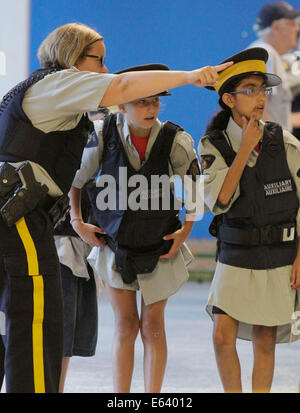 Coquitlam, Canada. 13th Aug, 2013. Children learn from police officers ...